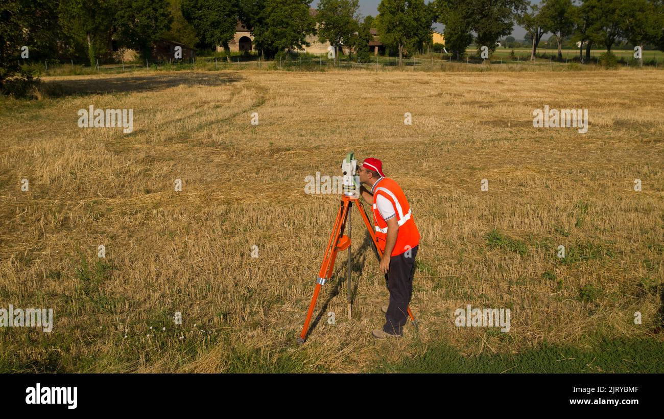 Land surveyor to measure land with survey equipment camera tool Stock ...