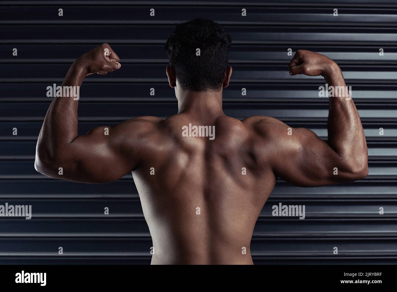 Athletic people flexing back muscles hi-res stock photography and ...