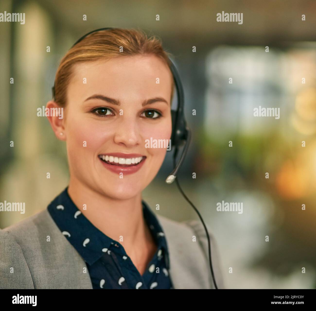 Hello. How can I be of assistance. Portrait of an attractive young ...