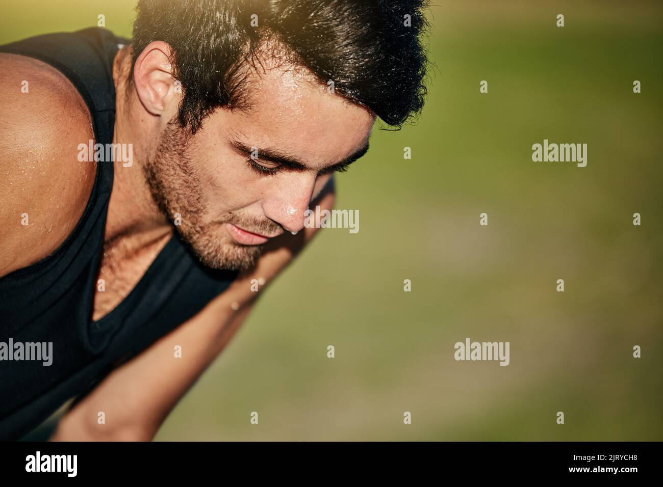 In fitness, consistency is key. a young jogger resting while out for a ...