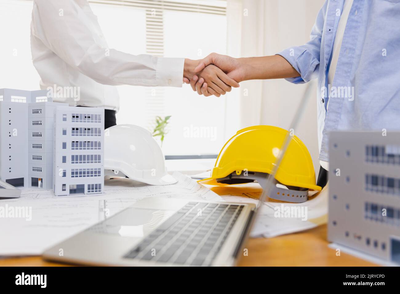 Successful architect and engineer success deal of build and ...