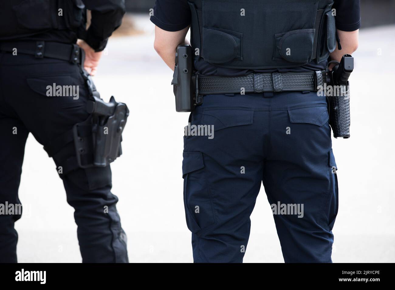 Daytime view of a white police officer's utility belt and gun holster ...