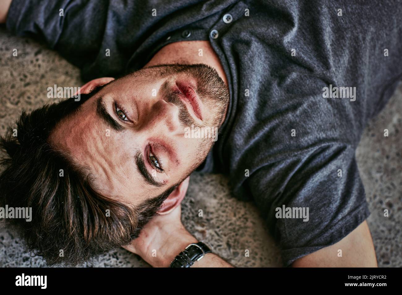 Hes a real mans man. High angle portrait of a beaten and bruised young ...