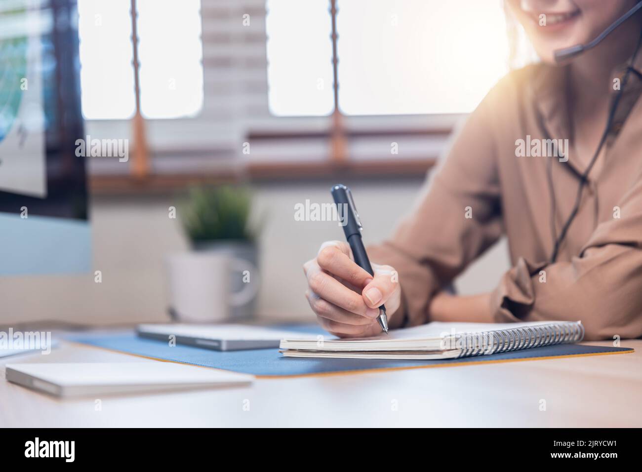 Woman writing on note hi-res stock photography and images - Alamy