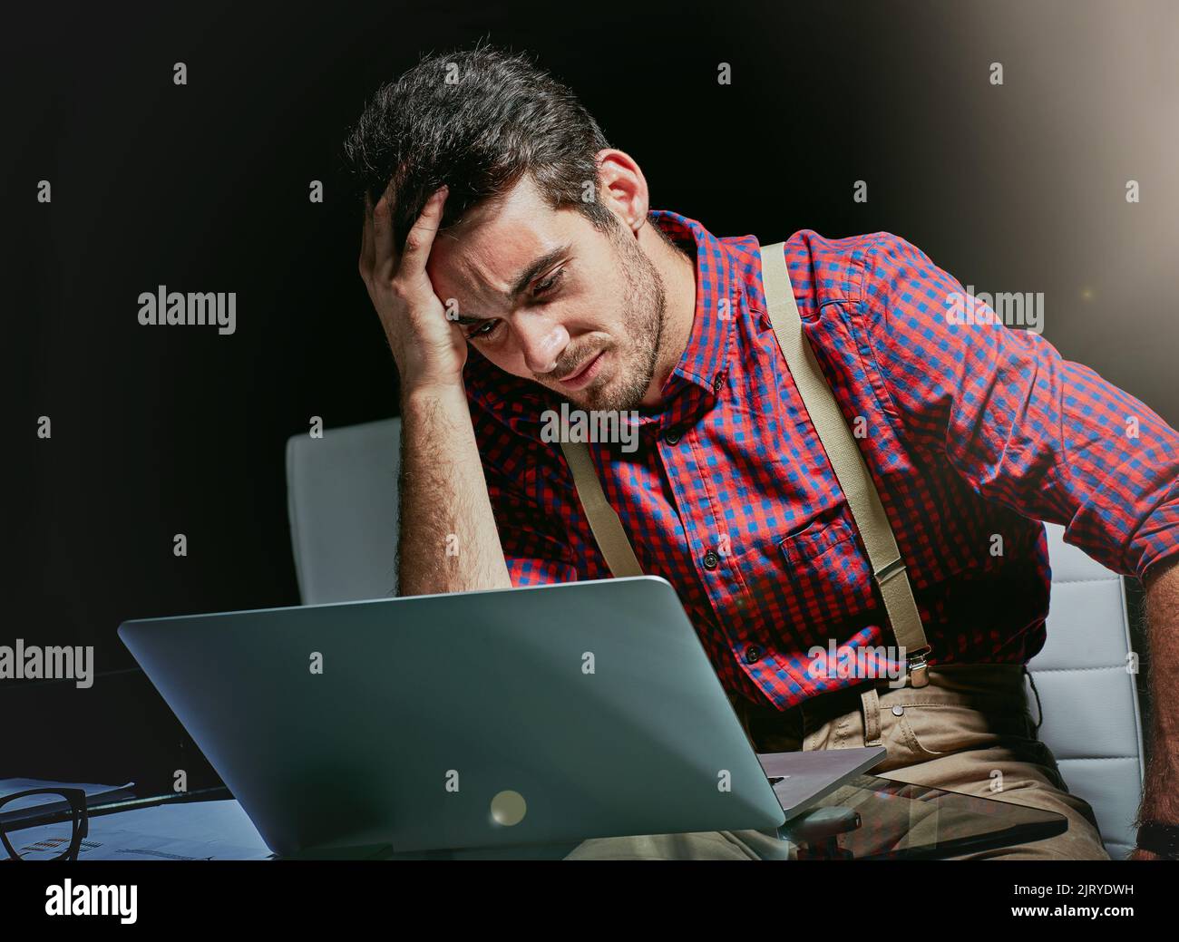 Going through a creative block. a frustrated young designer looking ...