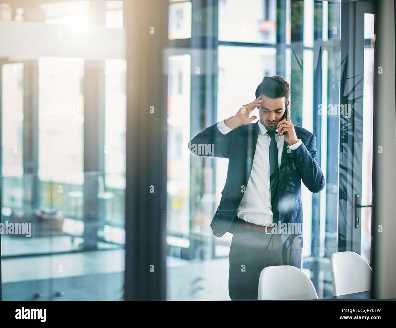 Bad news comes calling. a young businessman losing his temper while ...