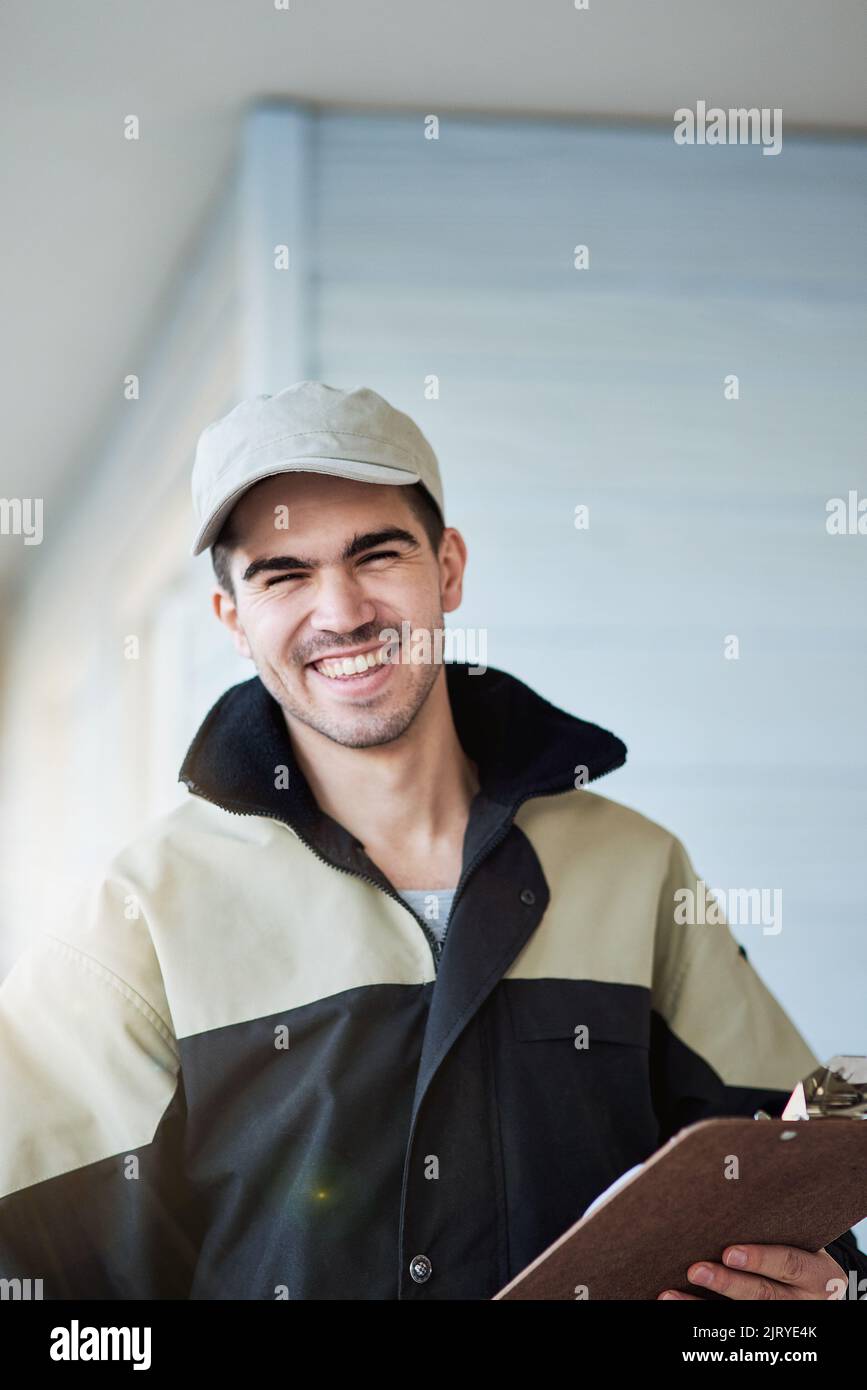 Time to do some more rounds. Portrait of a delivery man holding a ...