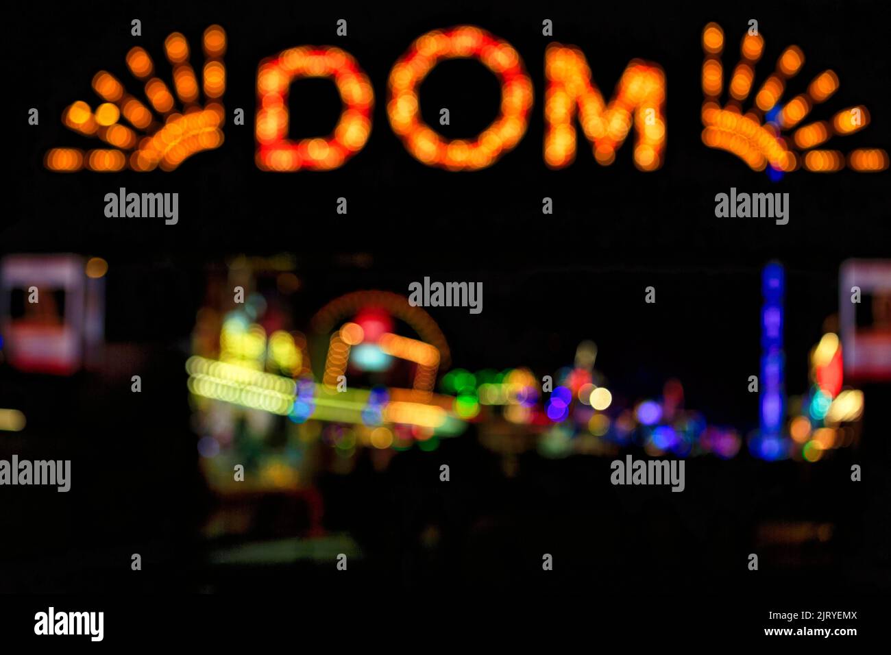 Colourful lights in the darkness, form the lettering Dom, entrance to ...