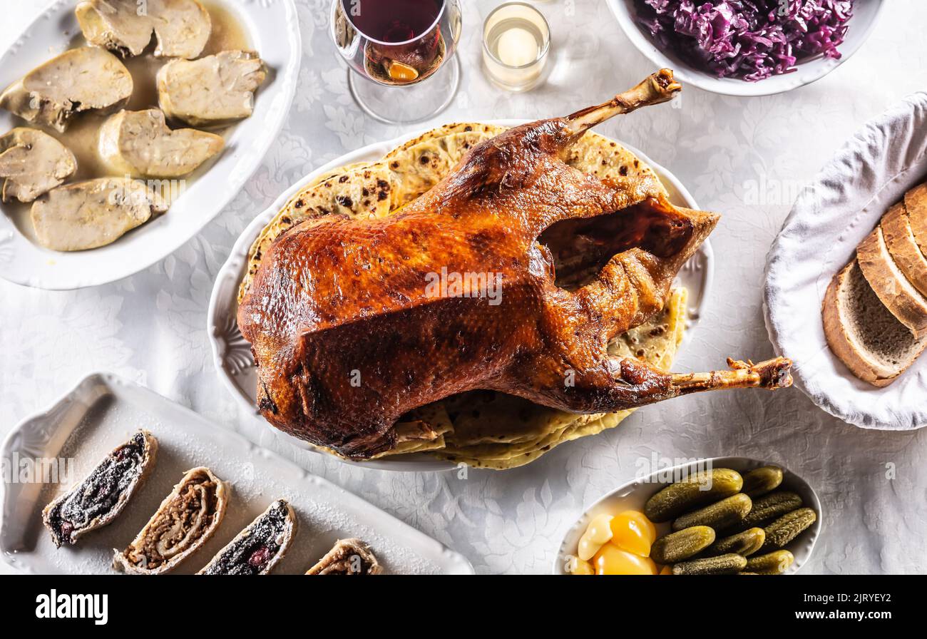 Roast goose with side dishes, red cabbage, roast, strudel, potato ...