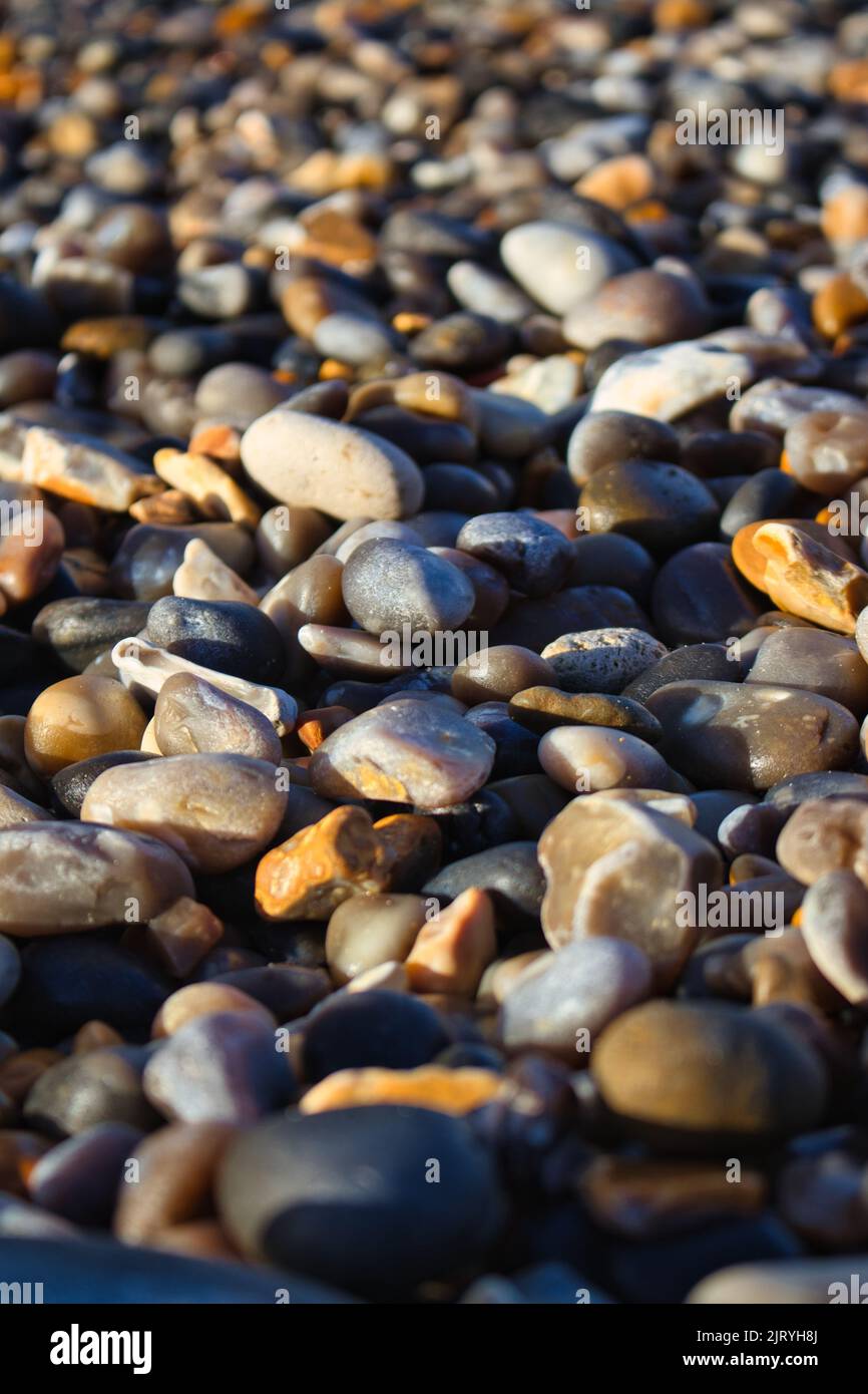 The vertical view of a stack of stones under the sunlight - good match ...