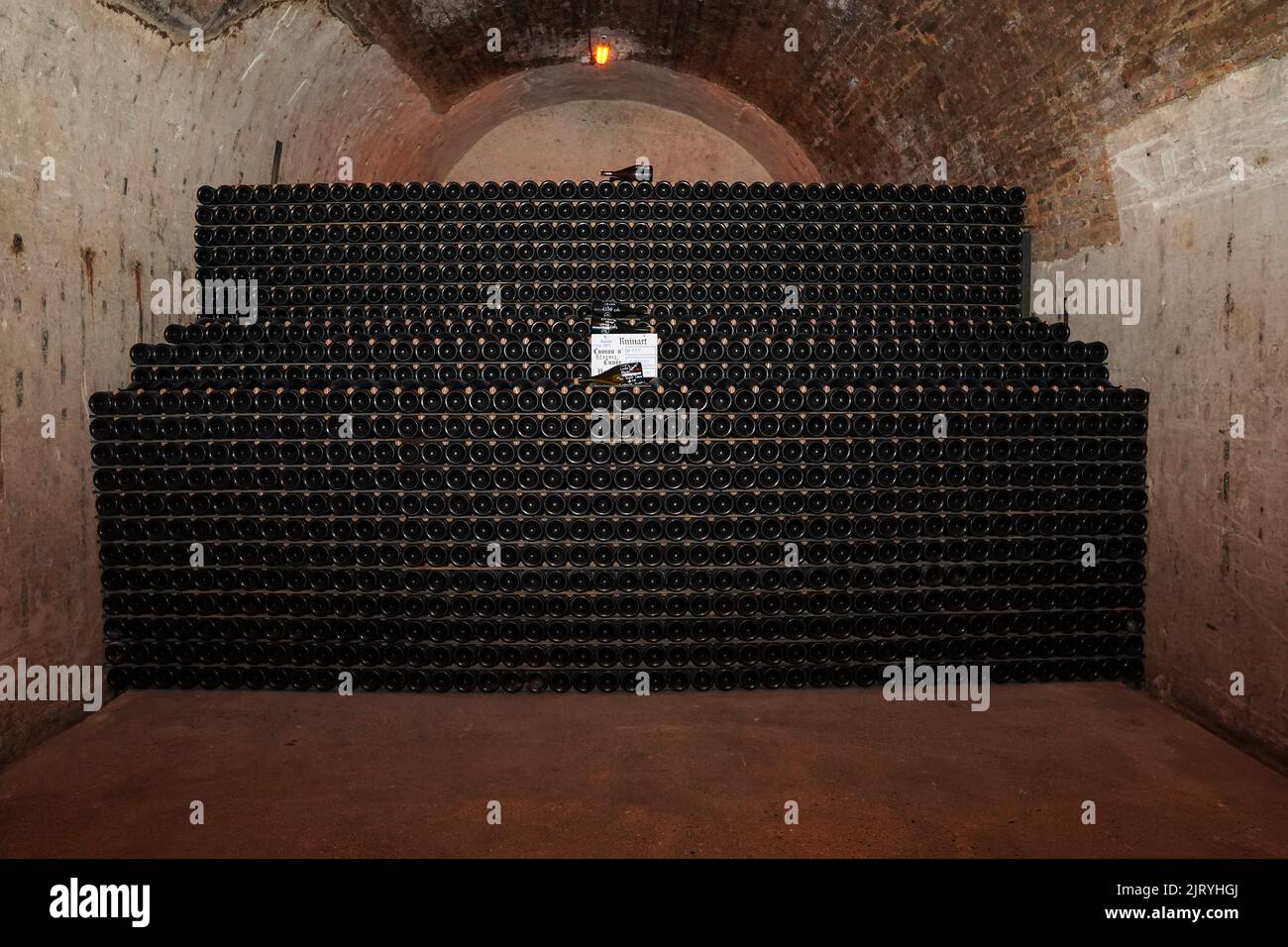 : Champagne bottles in pupitre, Ruinart champagne cellar in Reims ...