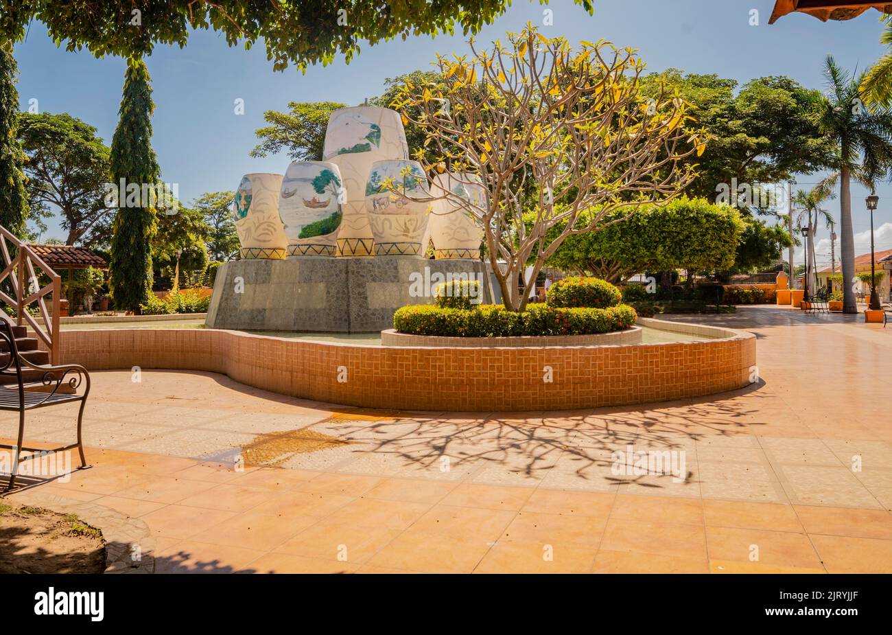 Image of a nice and relaxed park with a water fountain surrounded by ...