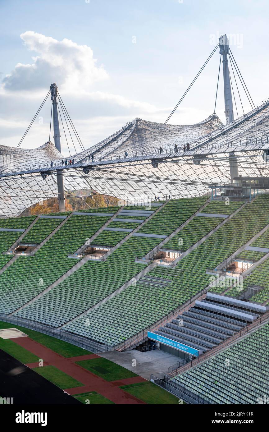 Silhoutten of people on the tent roof of the Olympiastadion ...