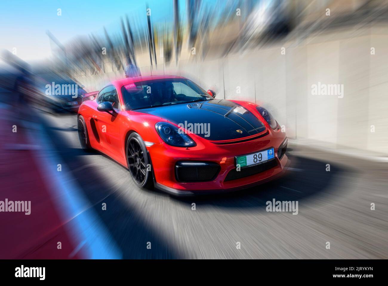 Dynamic photo with zoom effect of sports car racing car red Porsche ...