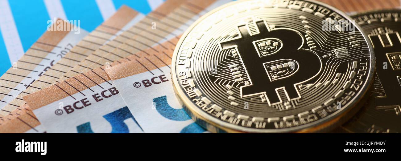 Bitcoin coin diagram and cash on table Stock Photo - Alamy