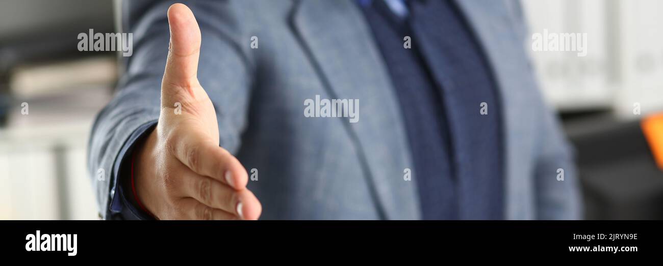 Businessman working in the office, reaching out hand forward for ...