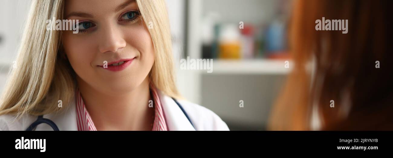 Female doctor explains diagnosis to patient closeup Stock Photo - Alamy