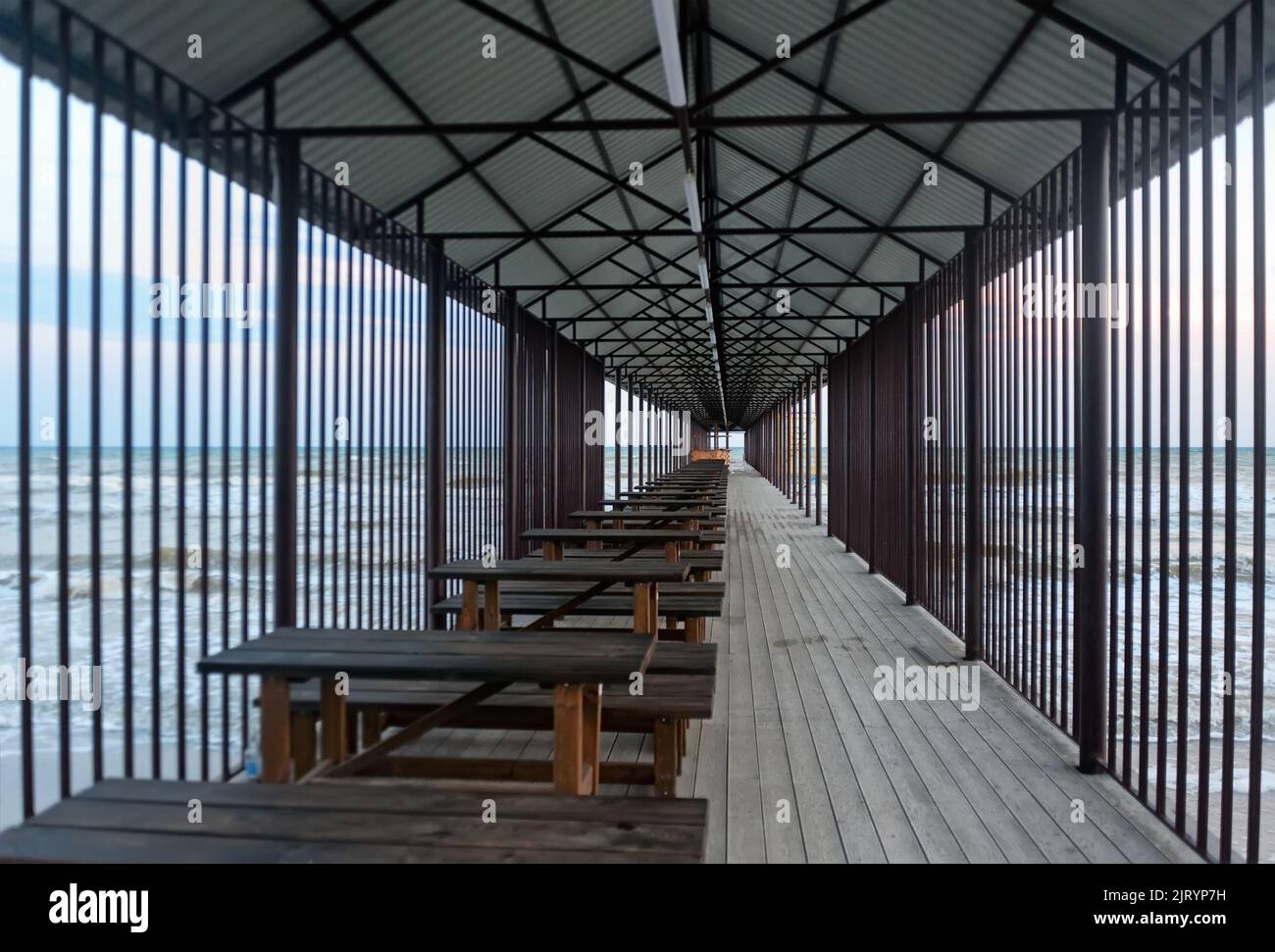 The inside view of the empty simple covered pier of Koblevo in Ukraine ...