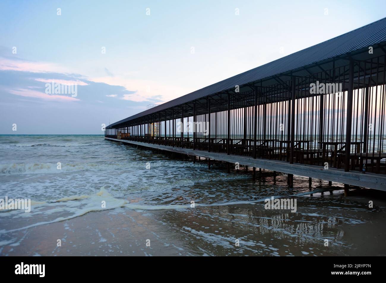 Side view of the empty simple covered pier of Koblevo in Ukraine with ...