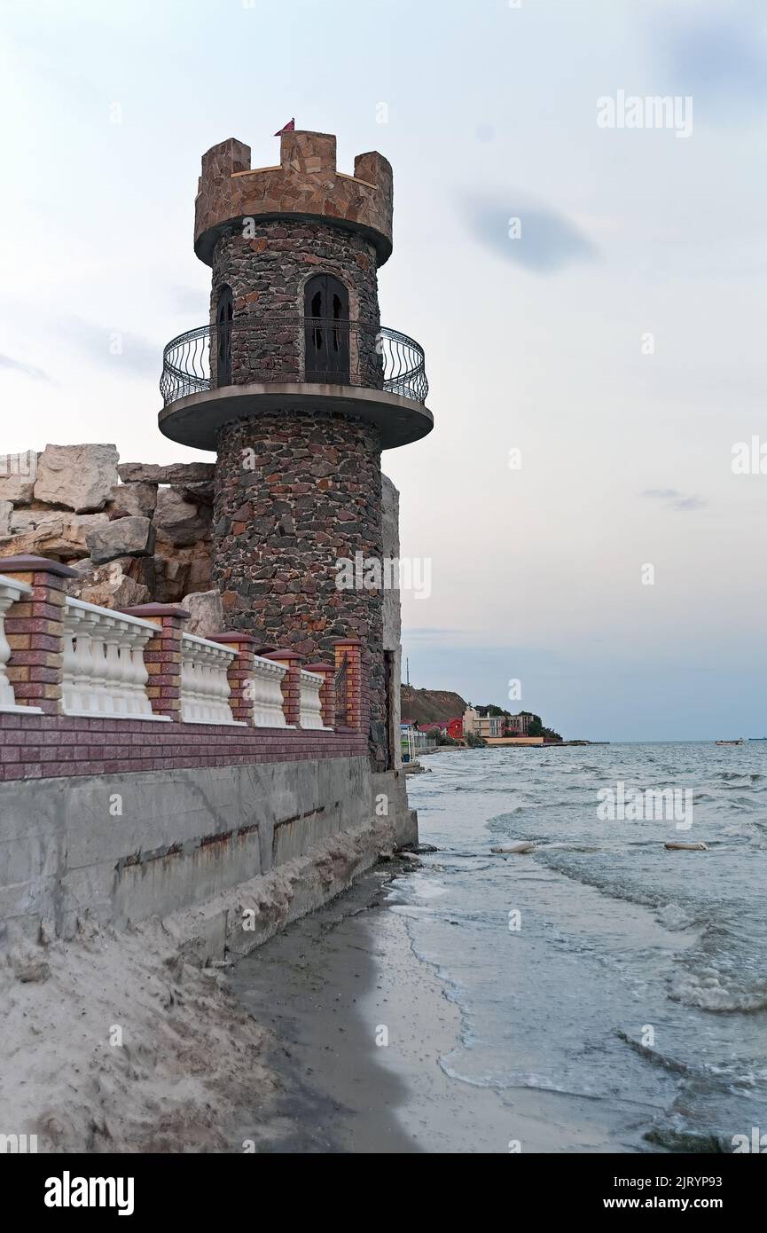 Tower over the black side at evening in Koblevo Ukraine Stock Photo - Alamy