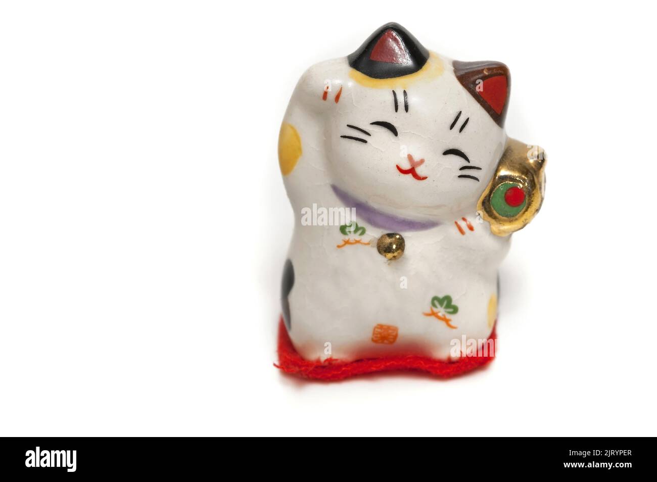 A maneki-neko, lucky cat, beckoning with an upright paw, japanese ...