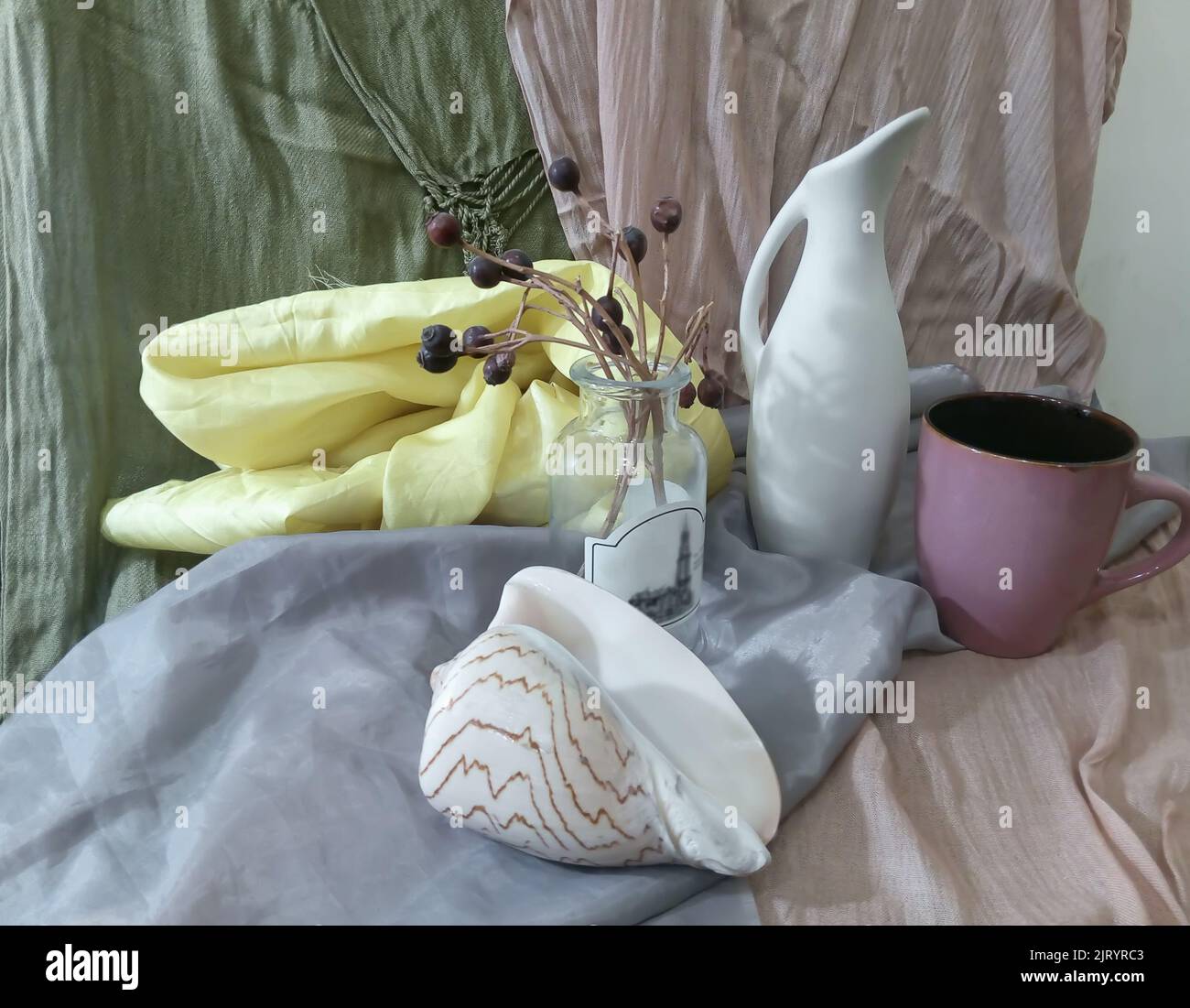 Still life with a white vase and sea shell Stock Photo - Alamy