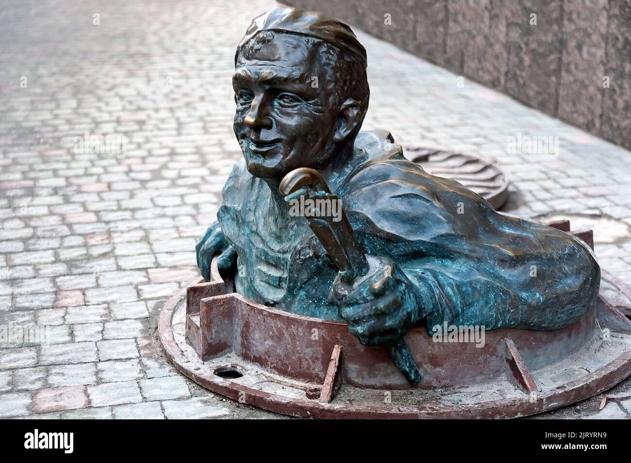 Man work sculpture in manhole hi-res stock photography and images - Alamy