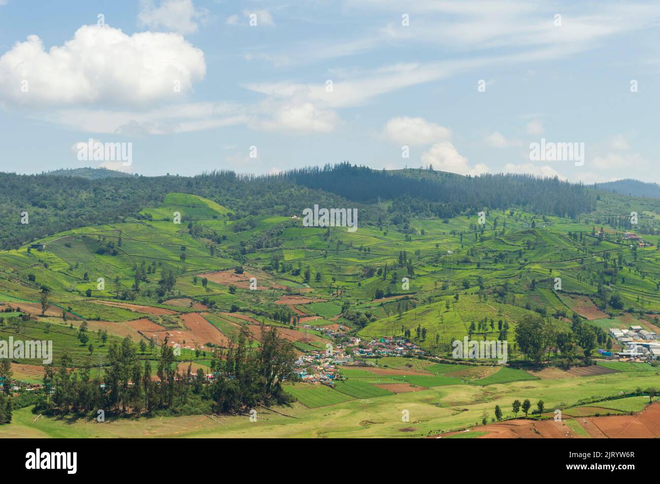 Towering mountains, sprawling tea gardens, nature's gift of greenery ...