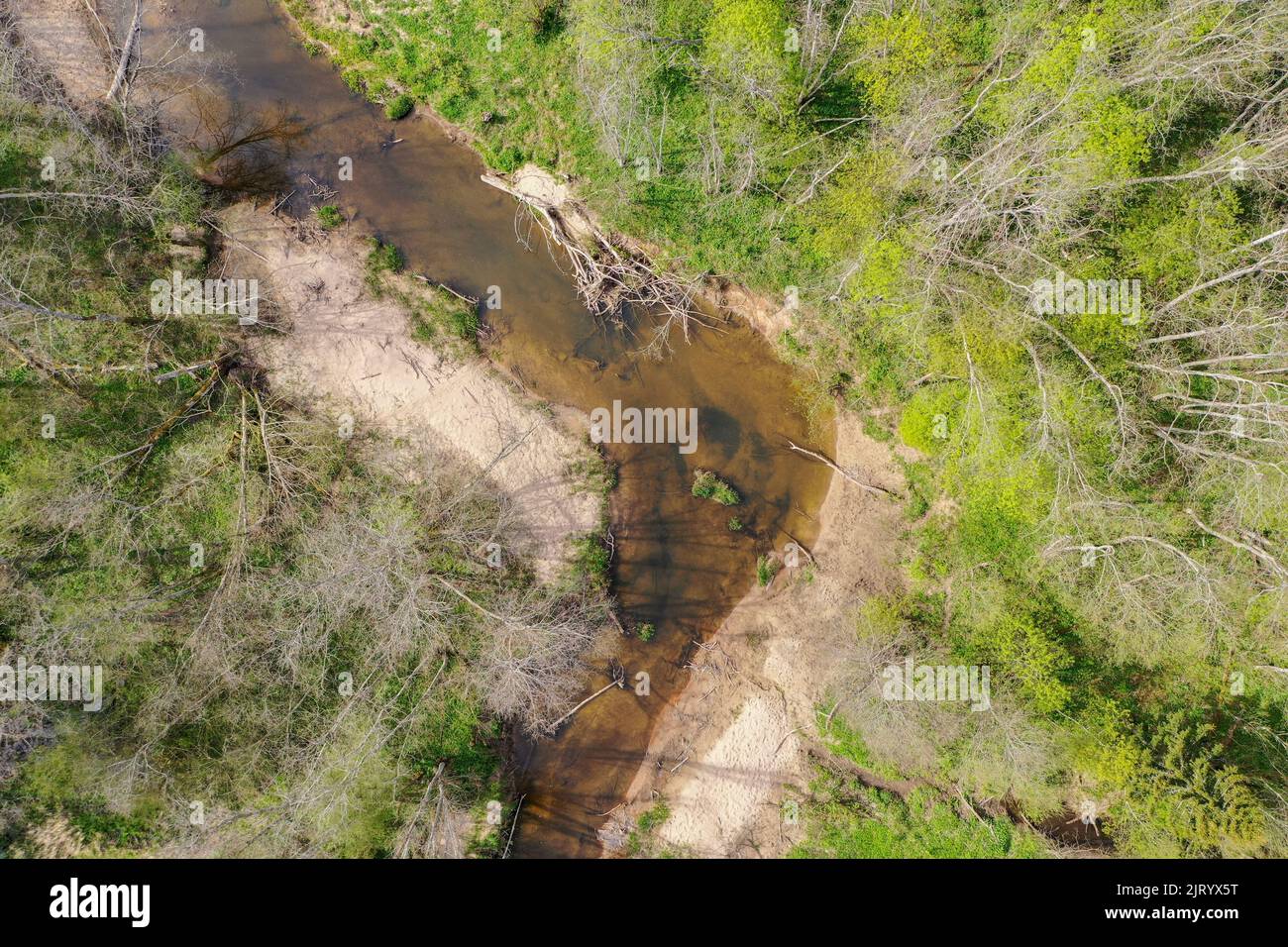 Aerial top down view of bendy river in spring Stock Photo - Alamy