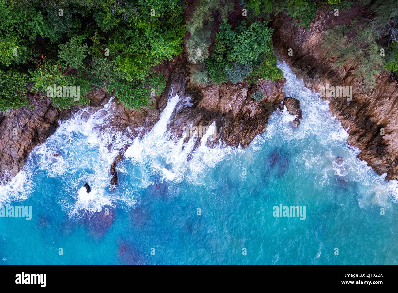 Aerial view Top down seashore big wave crashing on rock cliff Beautiful ...