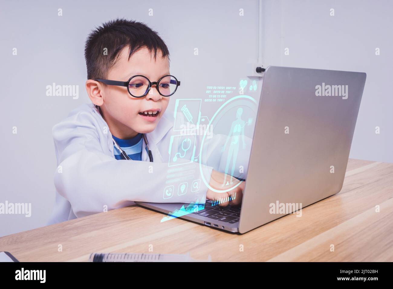 Asian boy working laptop hi-res stock photography and images - Alamy