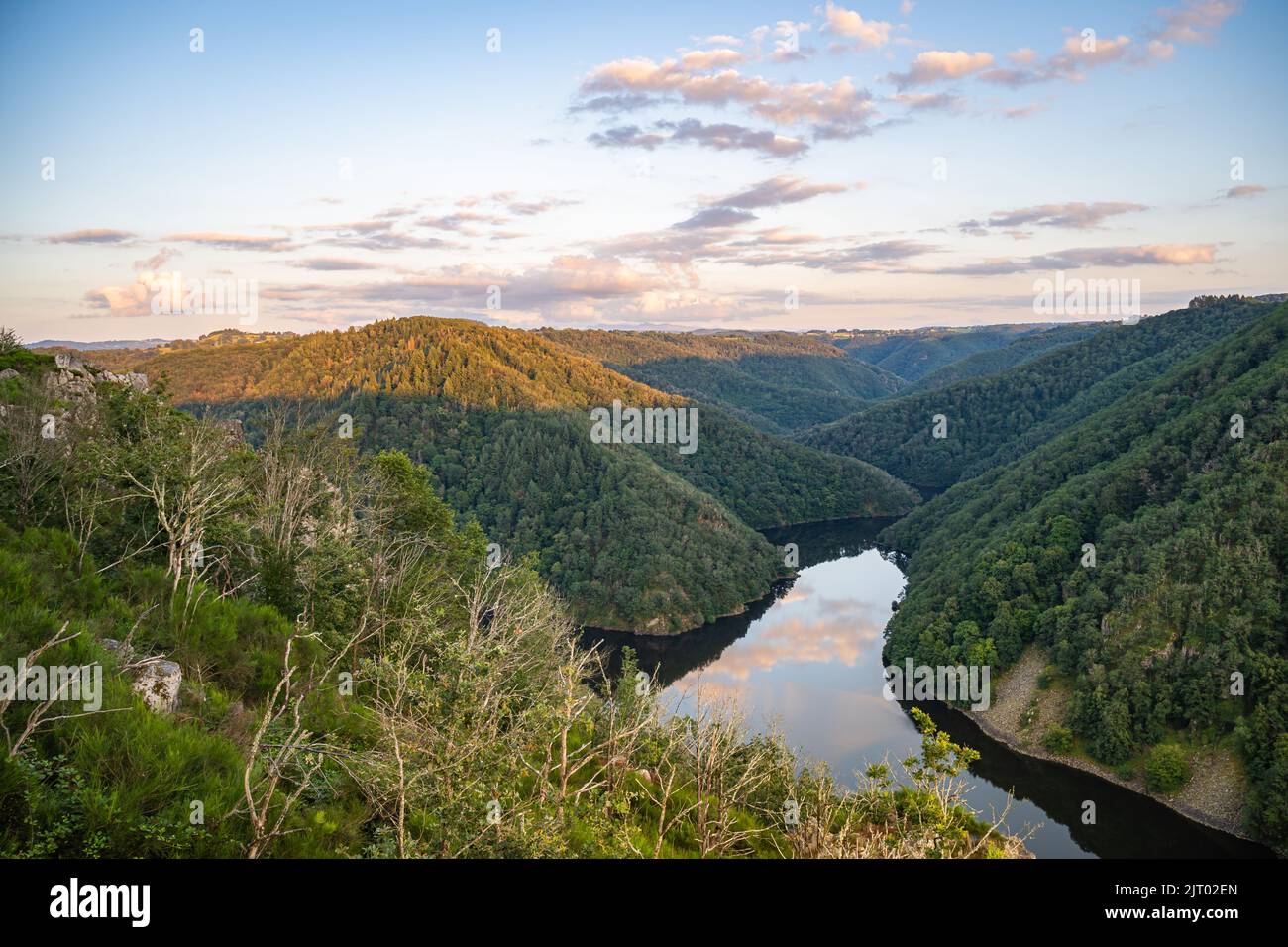 Start of golden hour on the landscape with reflection in water, end of ...