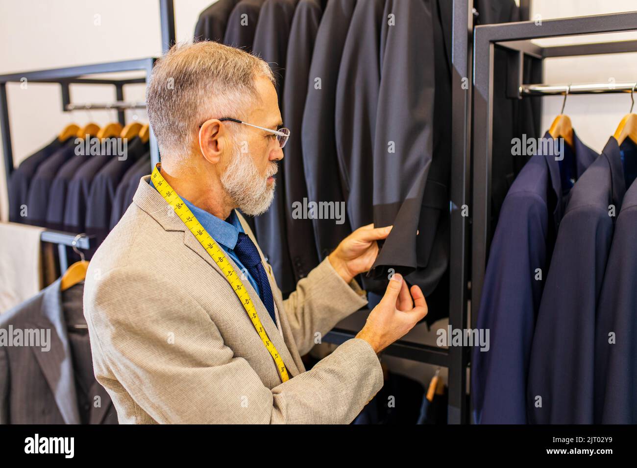elderly good looking man in stylish and rich suit owner of atelier ...