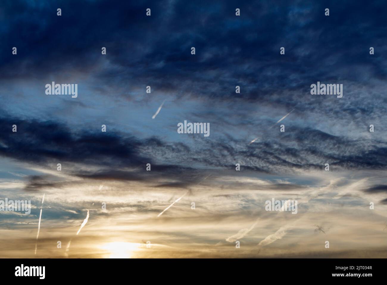 Contrails all over the sky Stock Photo - Alamy