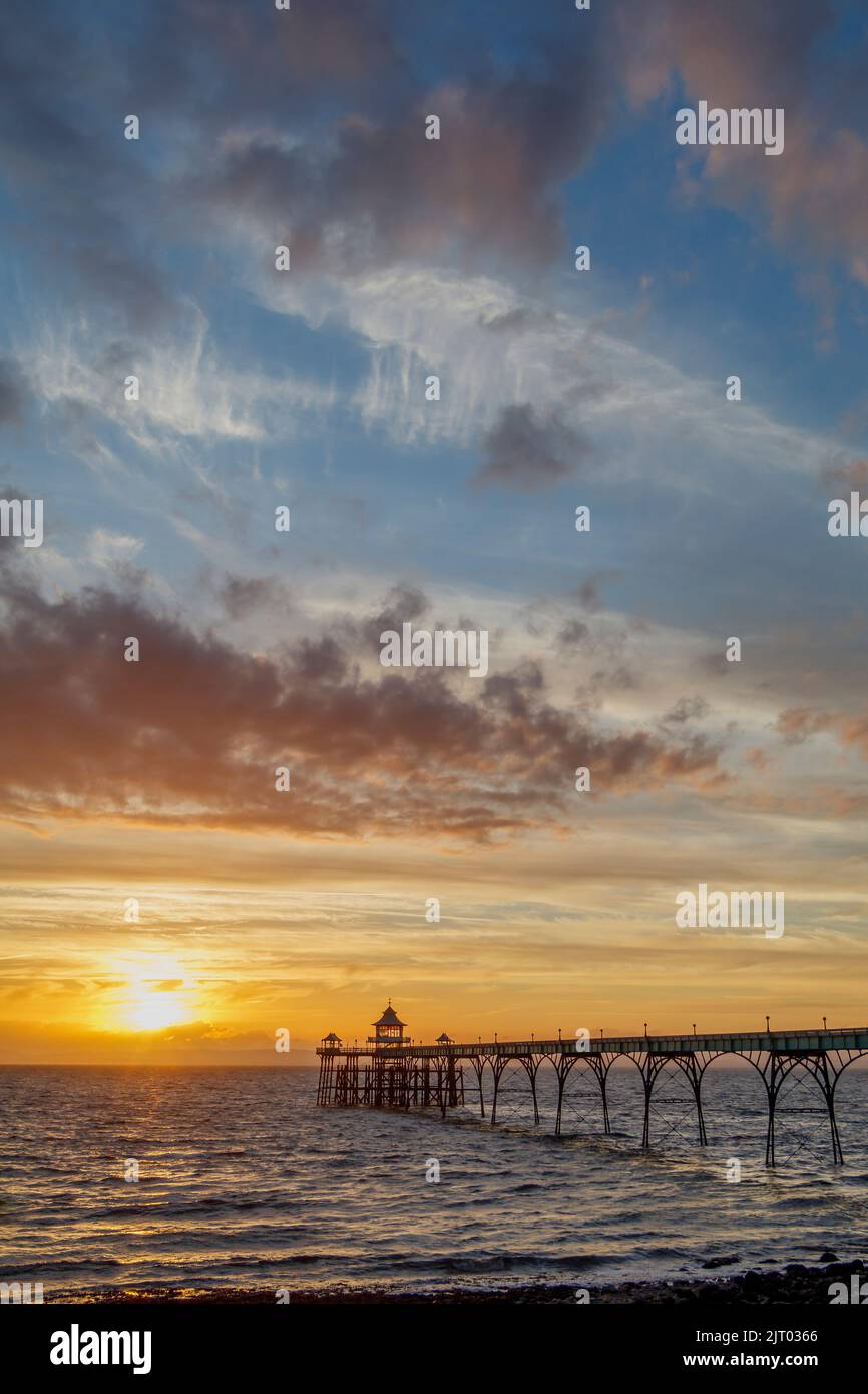 The setting sun lighting up the horizon Stock Photo - Alamy