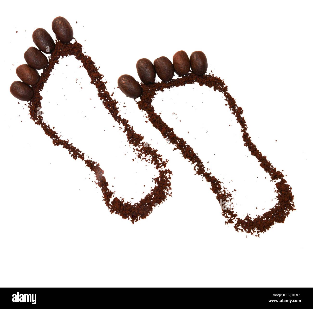 foot lined with grains of ground and instant coffee isolated on white ...