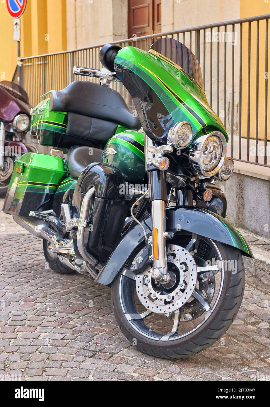 old retro motorcycle traveling through city streets Stock Photo - Alamy