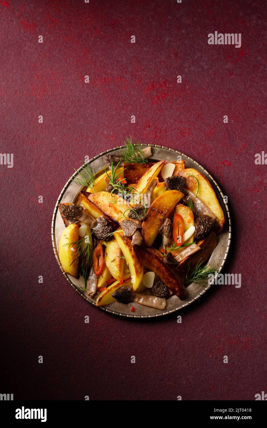 Peasant-style potatoes with wild mushrooms morels seasoned with chili ...