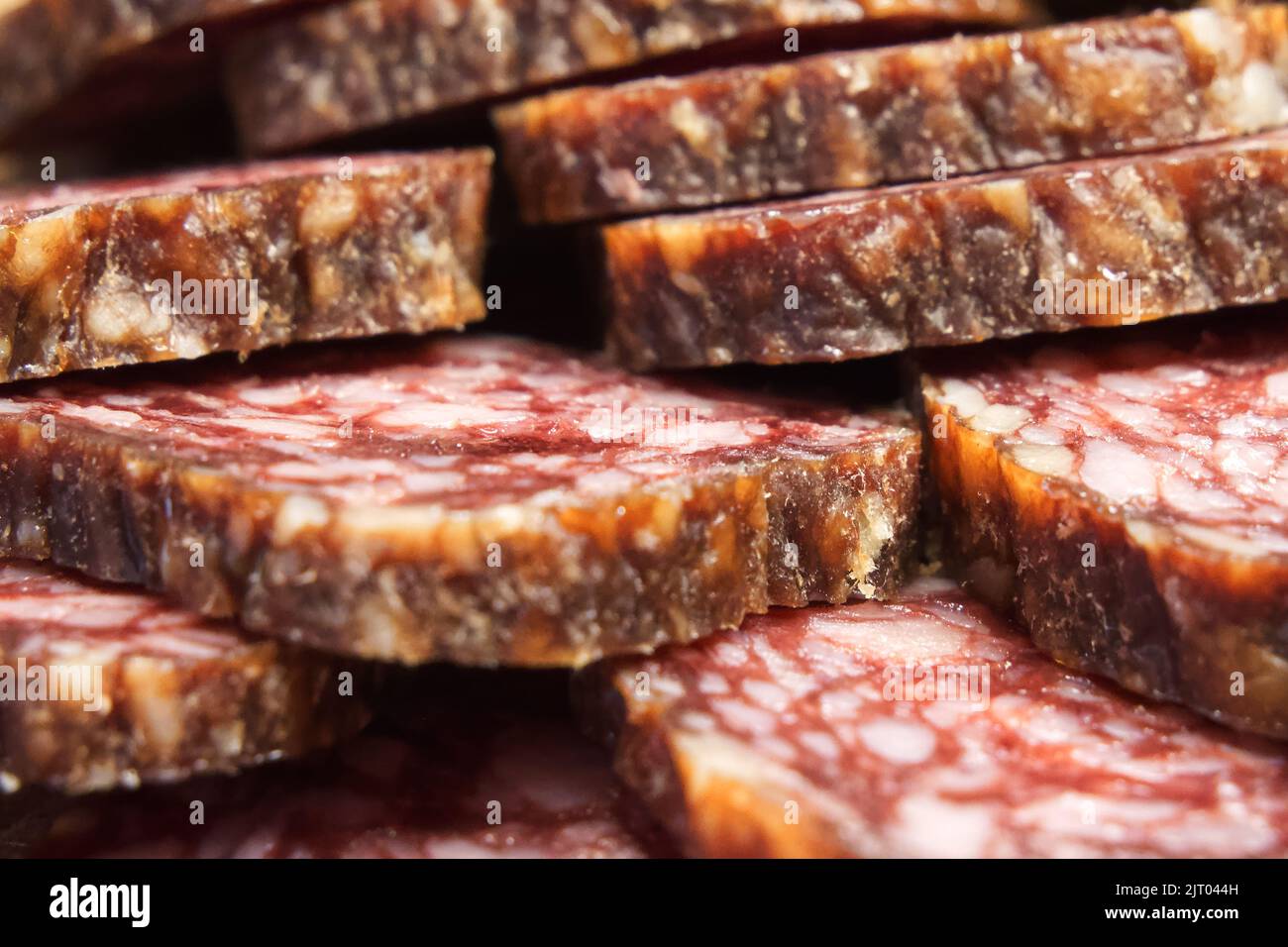 Chunks of dried sausage taken in macro. Meat products Stock Photo - Alamy