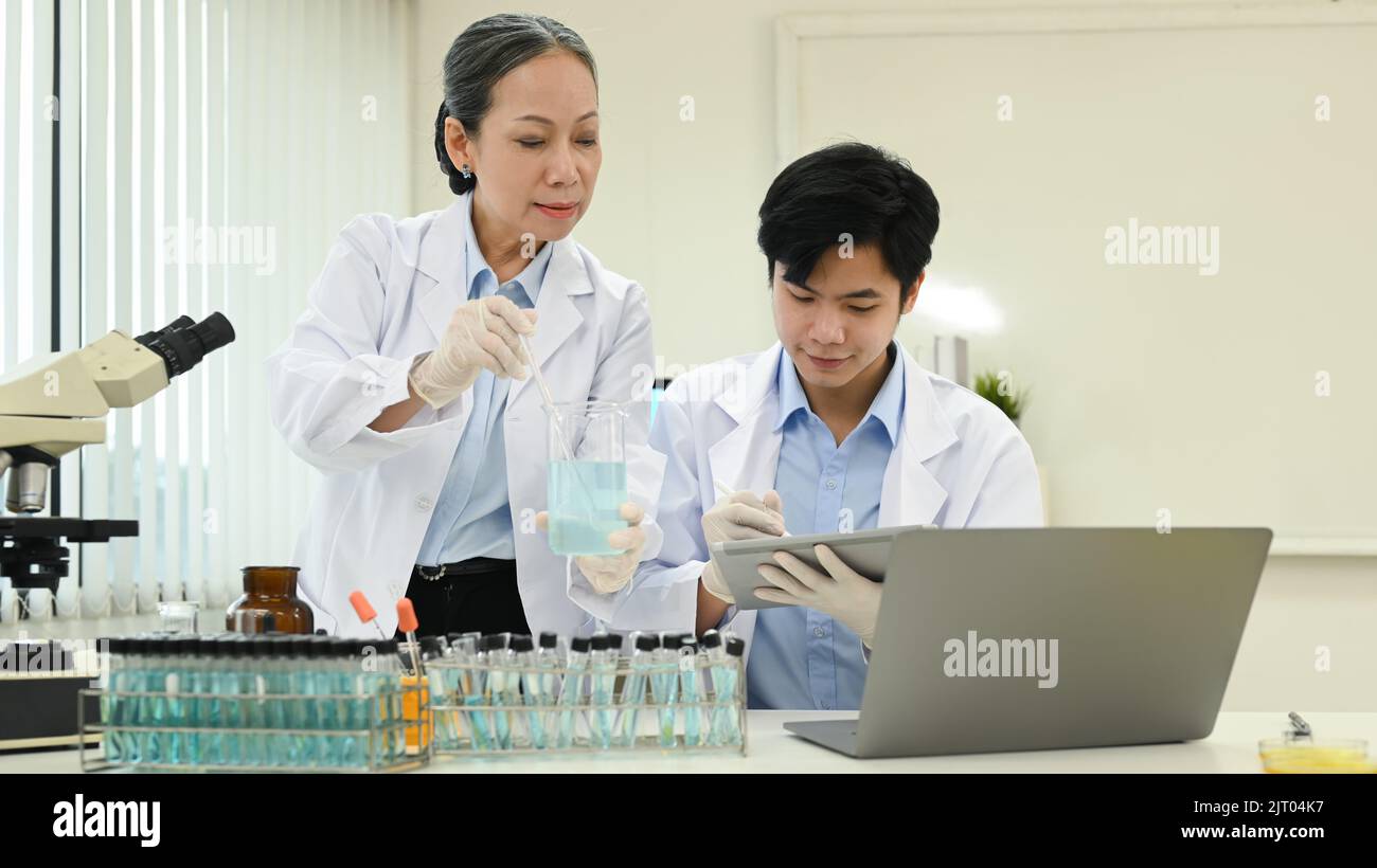 Scientist conducting experiment hi-res stock photography and images - Alamy