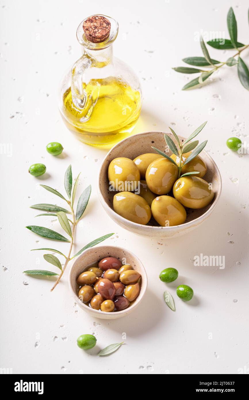 Healthy and fresh olives in bowls ready to eat. Preserves made from ...