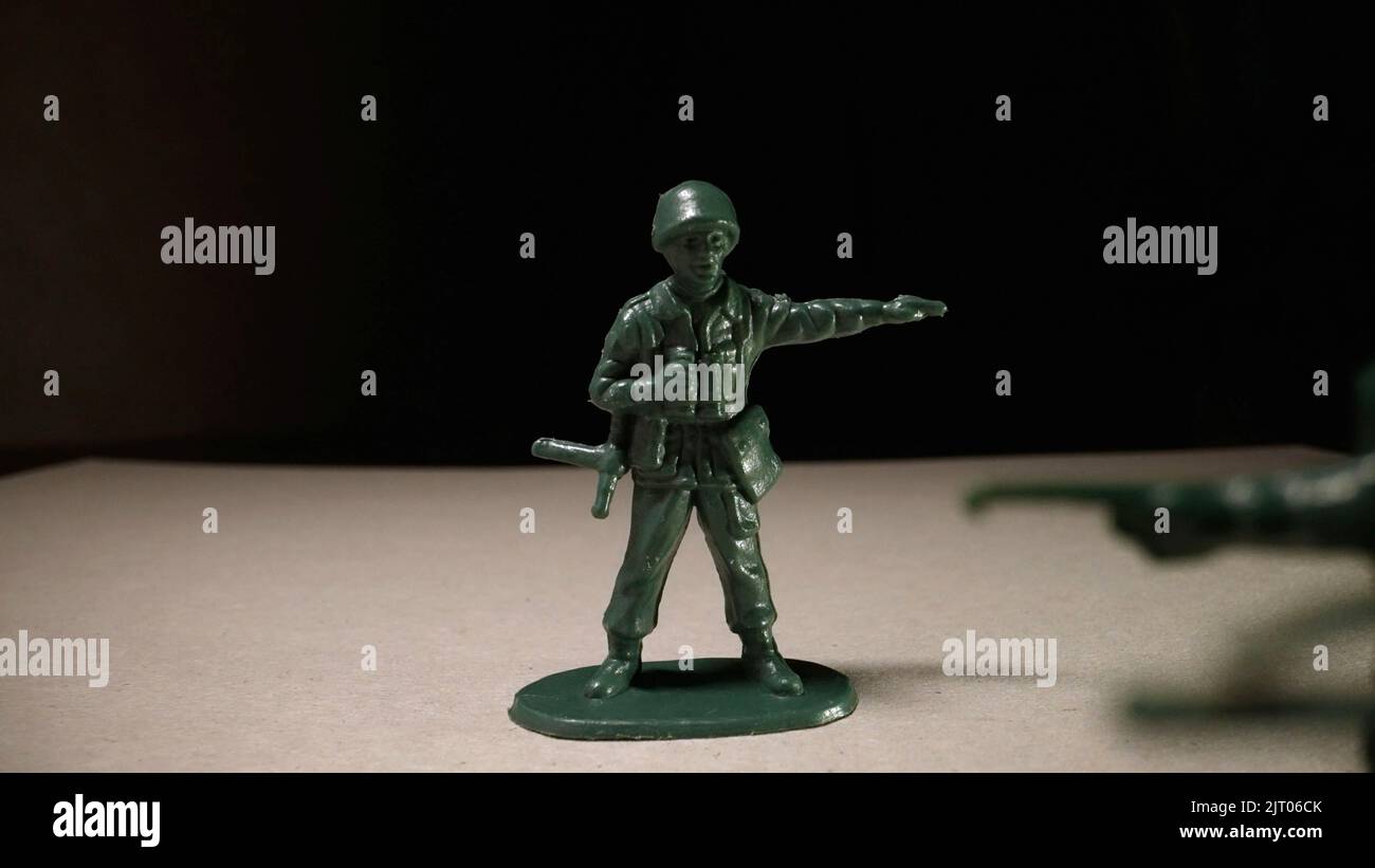 Toy soldier shows with his hand. Military soldier toy. Plastic toy ...