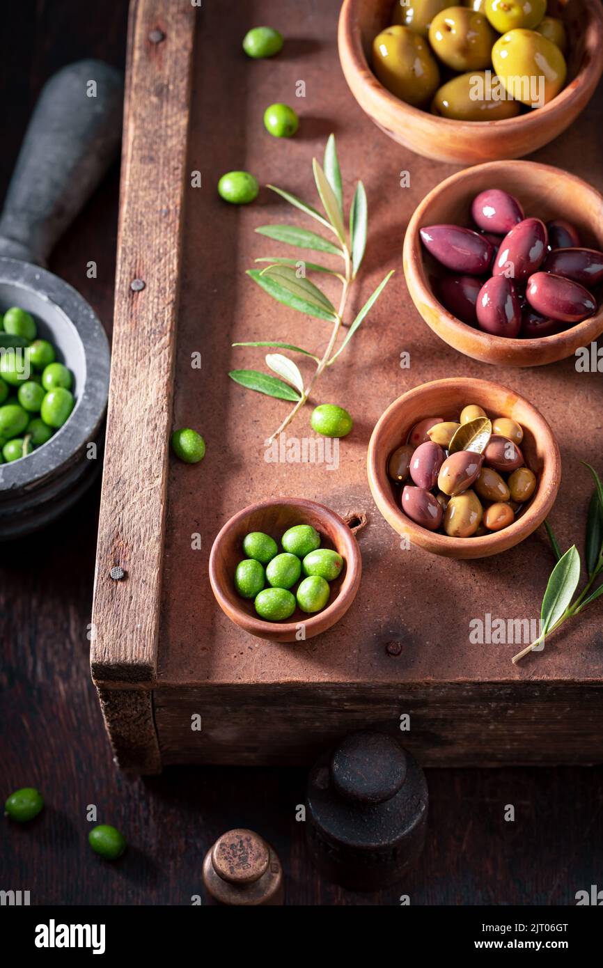 Various types of olives and aromatic olive oil. Products made of olives ...
