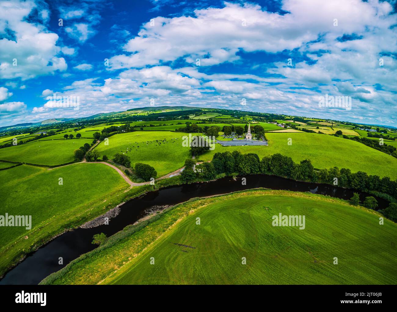 An aerial drone view of the Cappagh Parish Church in Northern Ireland ...