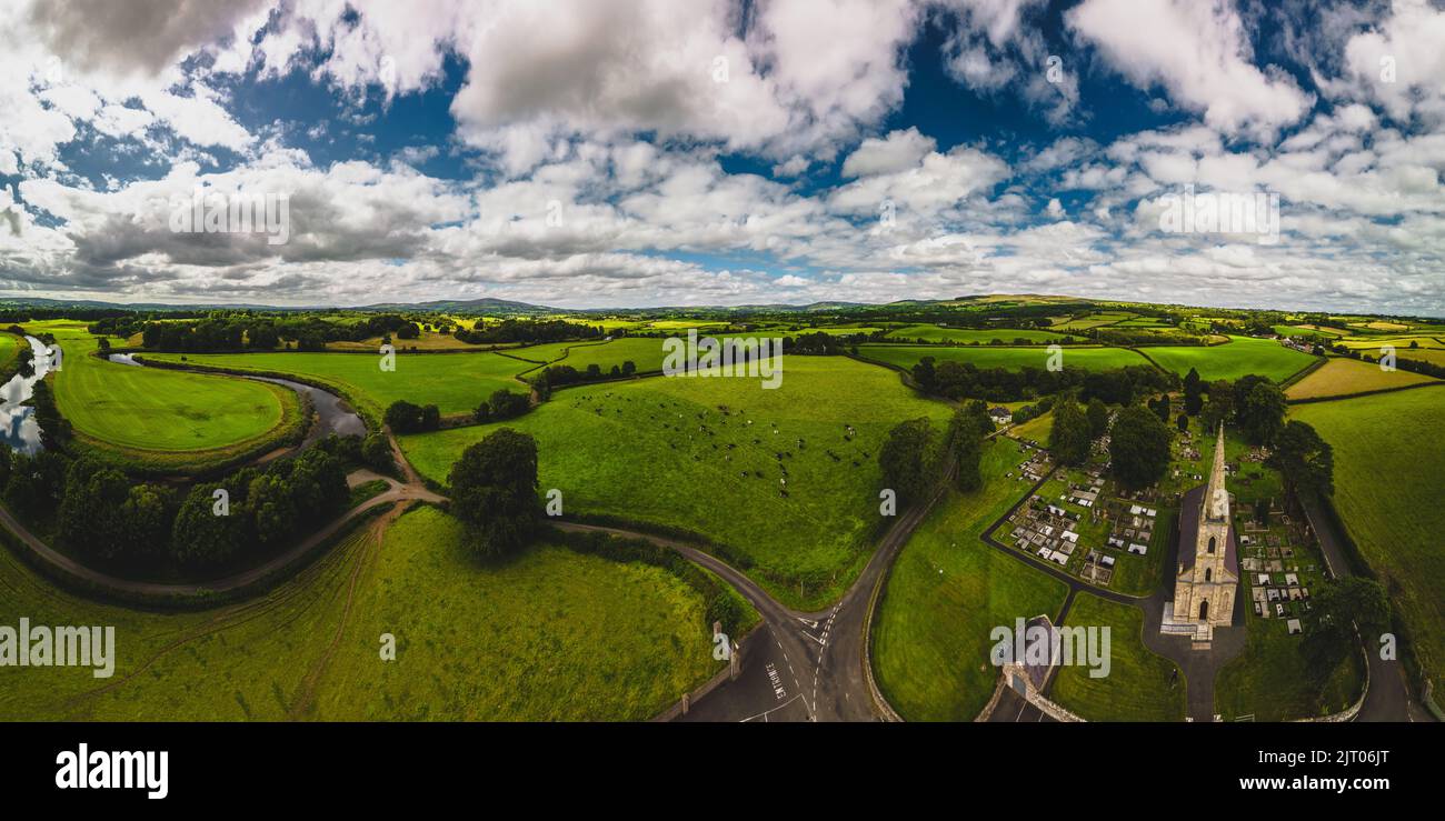 An aerial drone panoramic shot of the Cappagh Parish Church in Northern ...