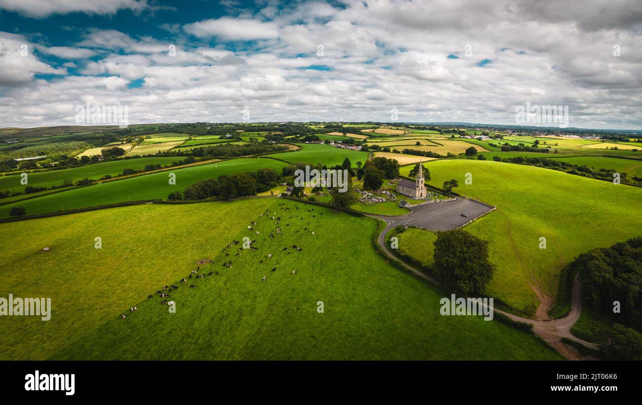 An aerial drone view of the Cappagh Parish Church in Northern Ireland ...