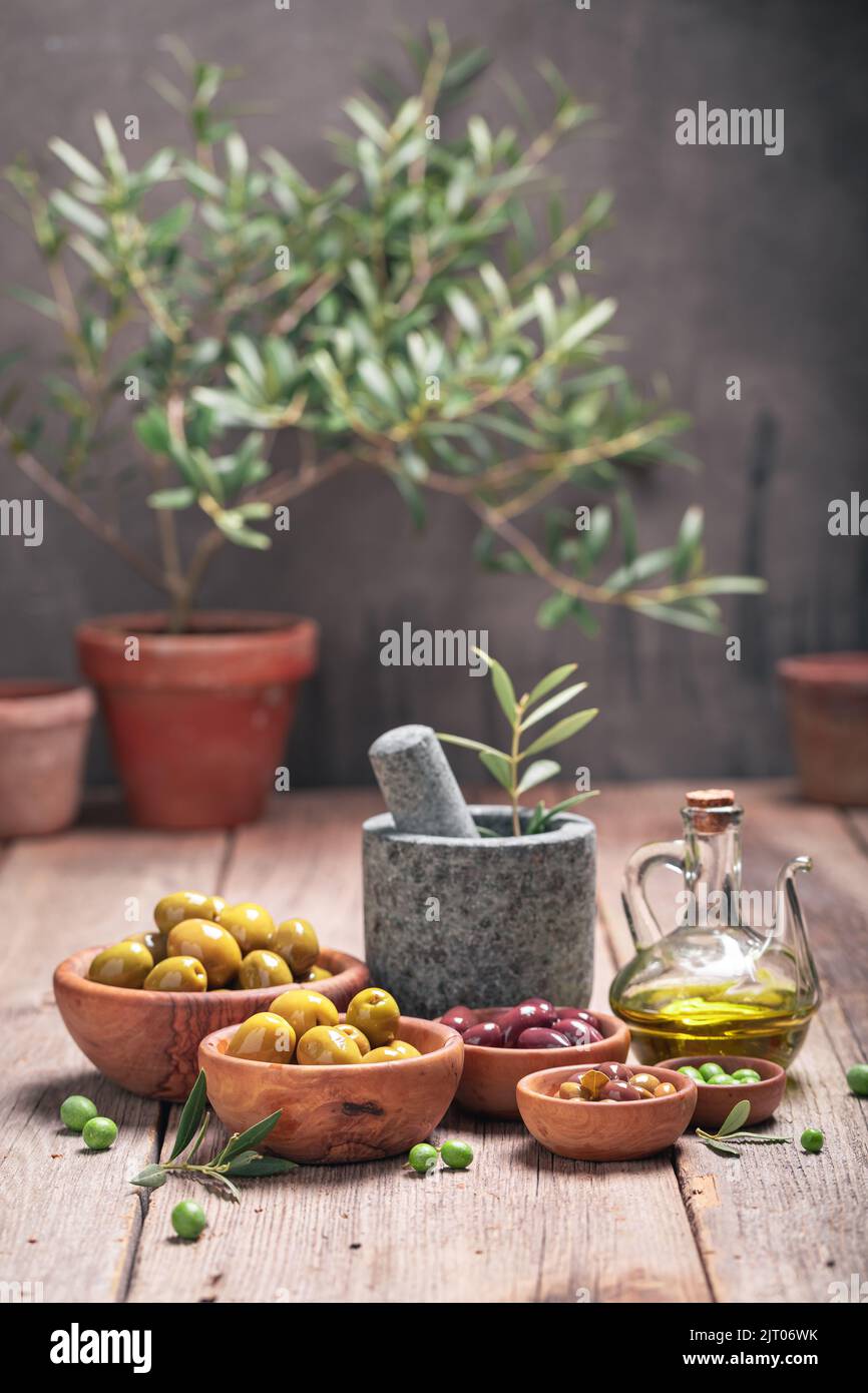 Various types of olives with extra virgin olive oil. Preserves made ...