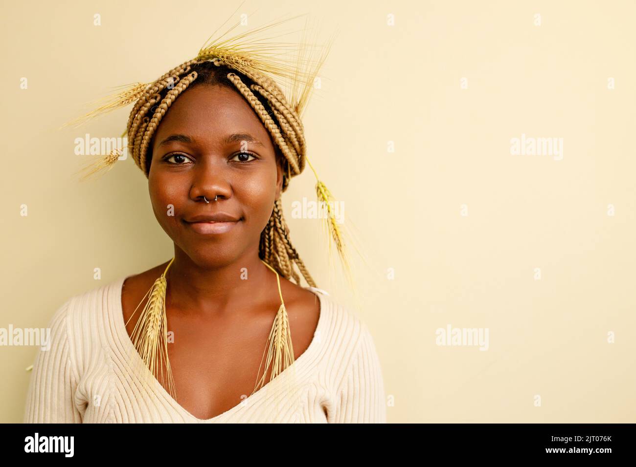 African american woman with braids and wheat plants Stock Photo - Alamy