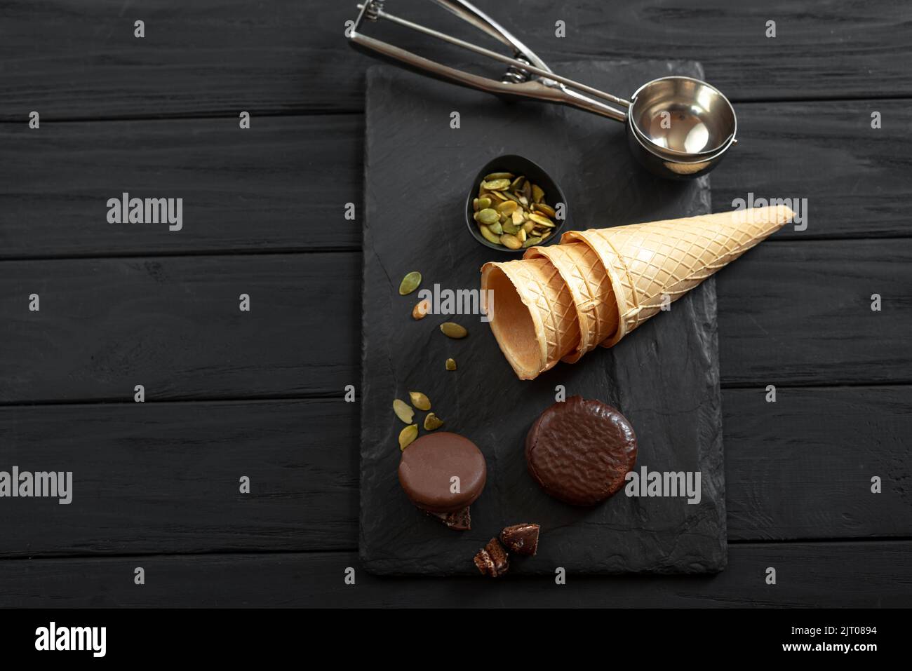 The process of making ice cream in a waffle cup. Top view. Ingredients ...