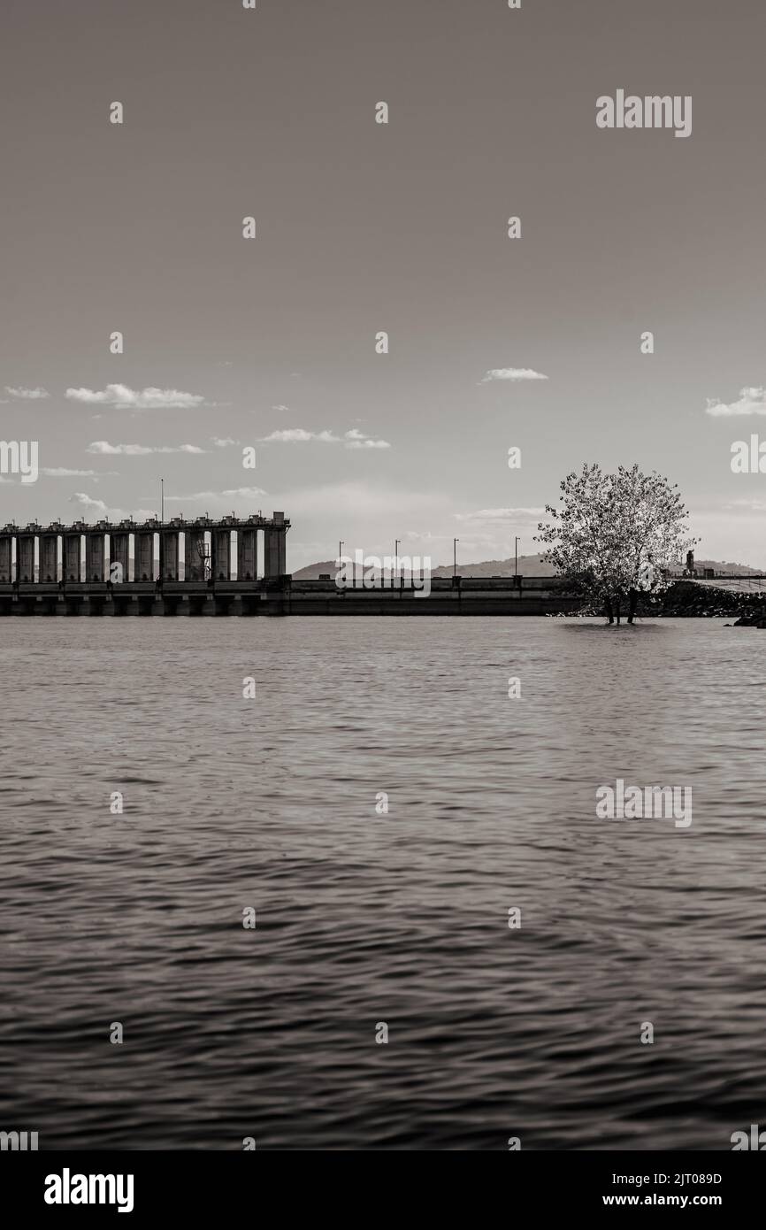 A vertical grayscale shot of the Hume Dam in Riverina, New South Wales ...
